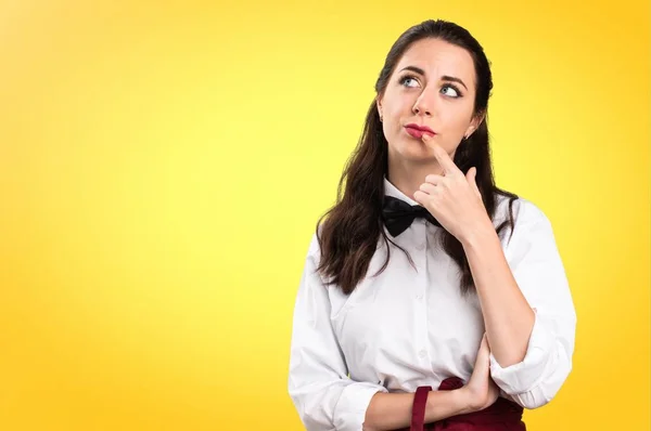 Young beautiful waitress freezing on colorful background — Stock Photo ...