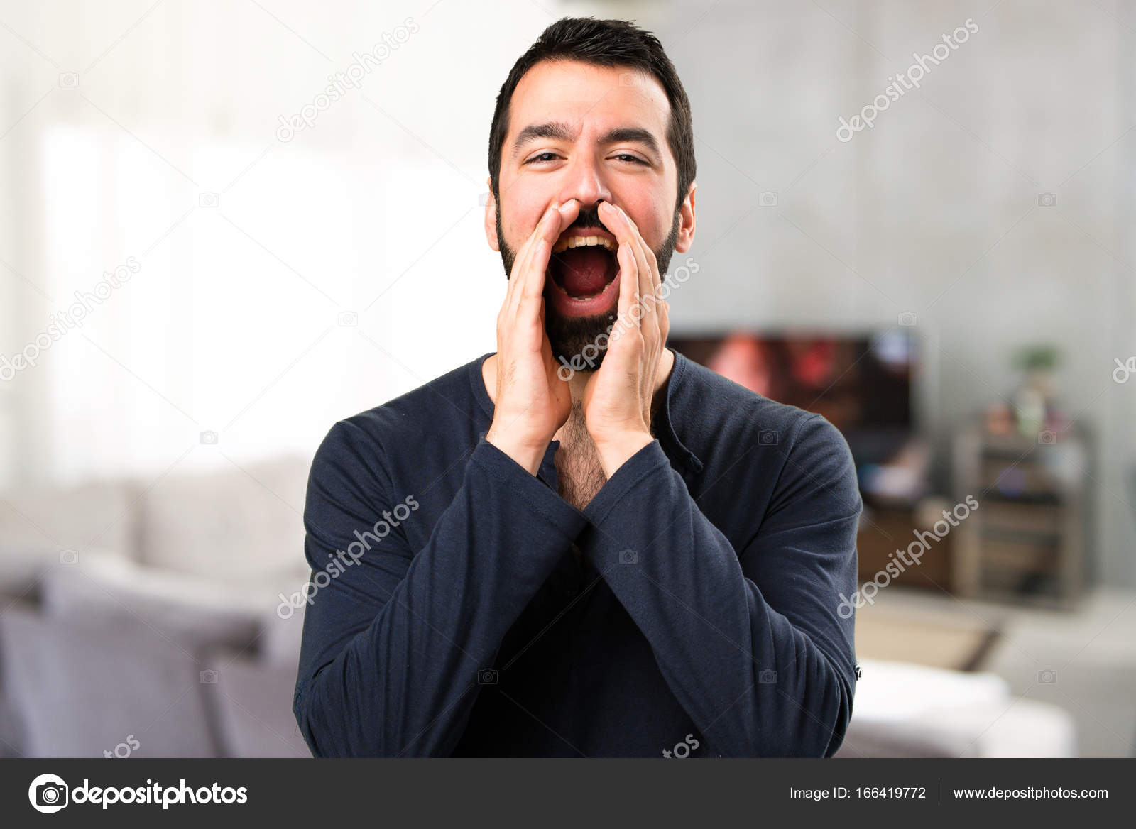 Handsome man with beard shouting inside house — Stock Photo ...