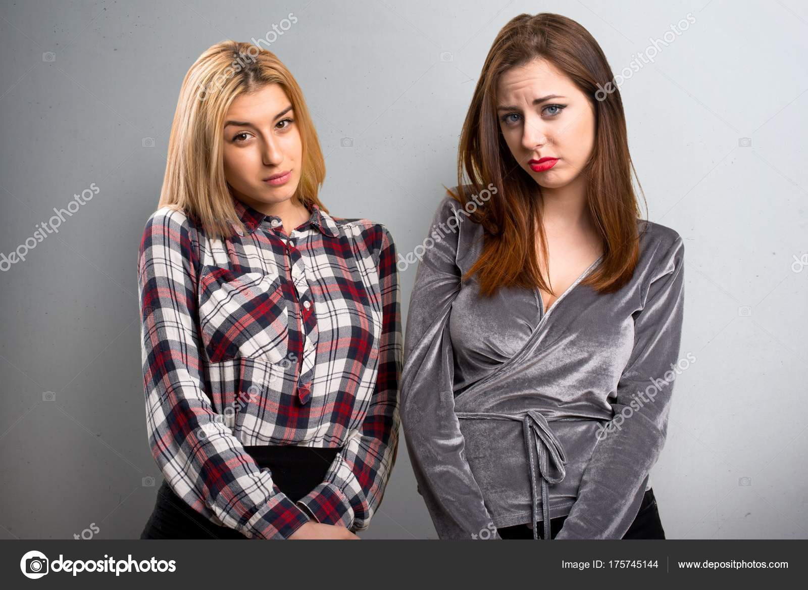 Sad two friends on textured background Stock Photo by ©luismolinero ...