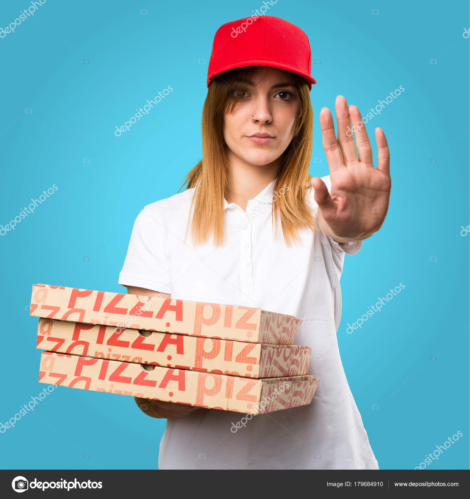 Pizza delivery woman making stop sign on colorful background Stock ...
