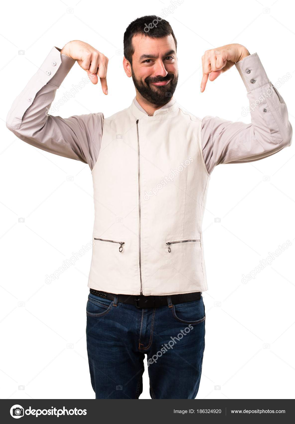 Handsome man with vest pointing down on isolated white background ...