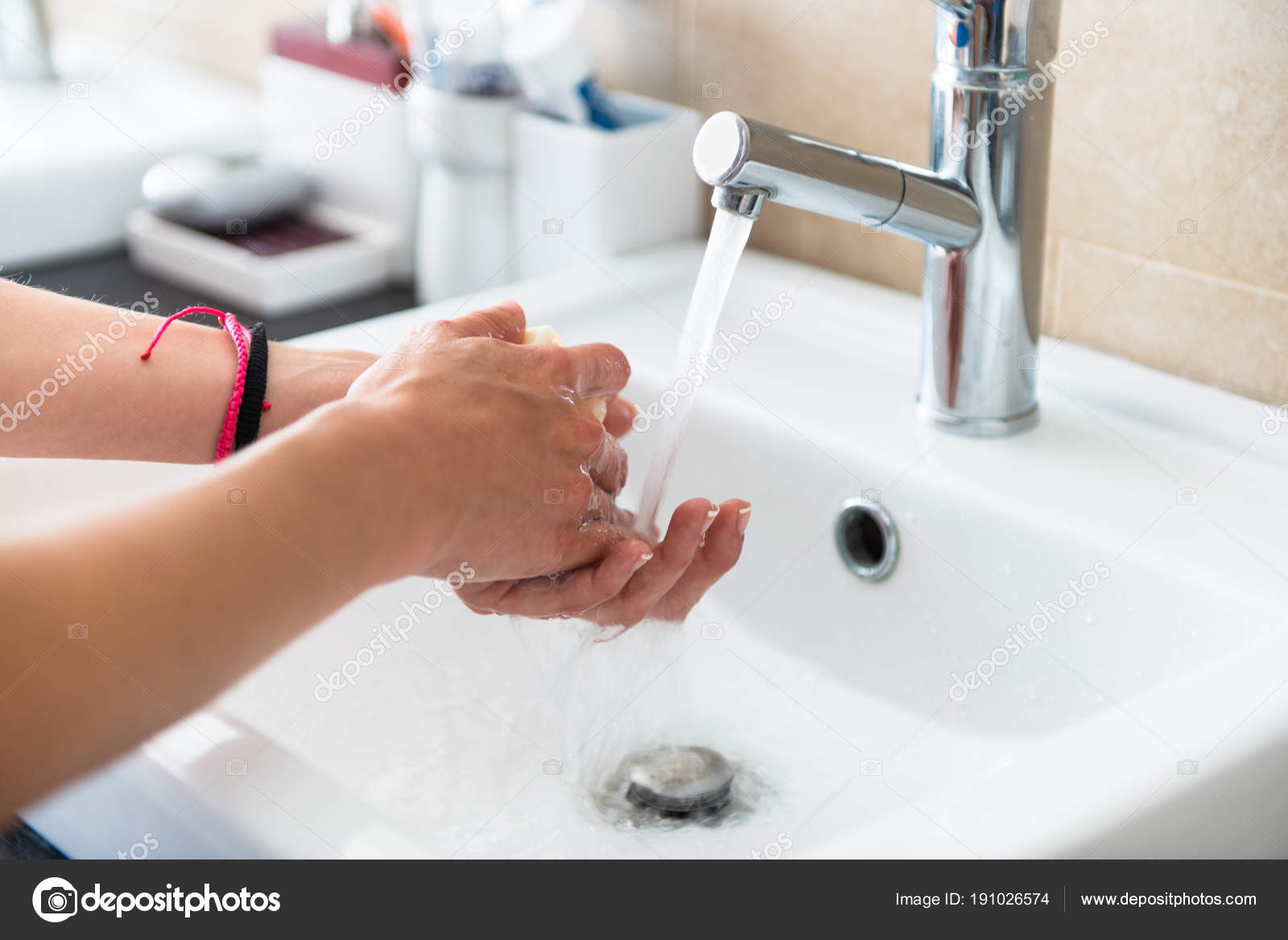 Beautiful young girl washing hands Stock Photo by ©luismolinero 191026574