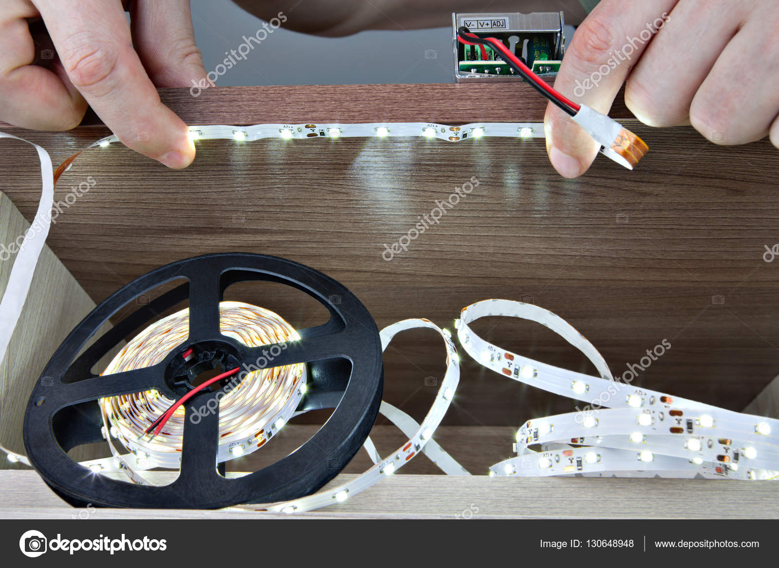 Installation of LED strip light for decorative lighting furniture Stock ...