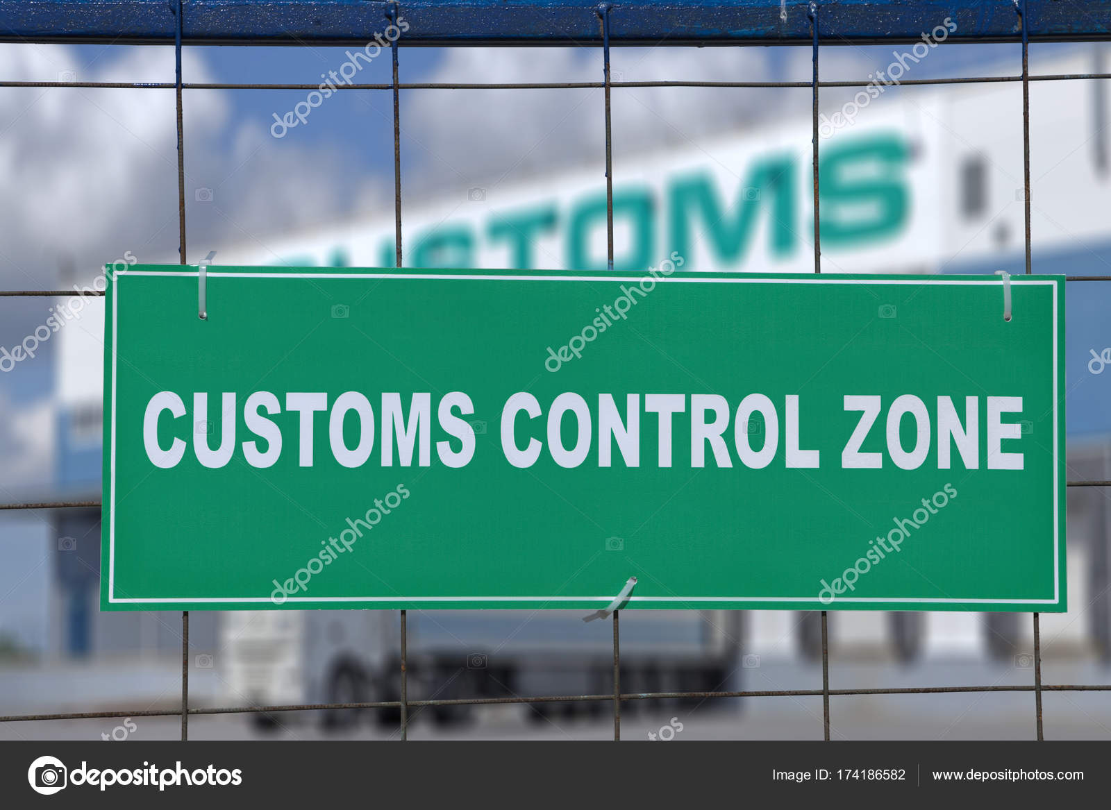 Green sign, customs control zone, on fence of logistic terminal ...