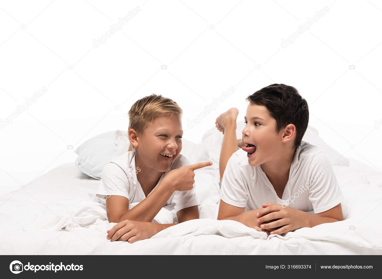 Cheerful Boy Pointing Finger Brother Sticking Out Tongue Isolated White ...
