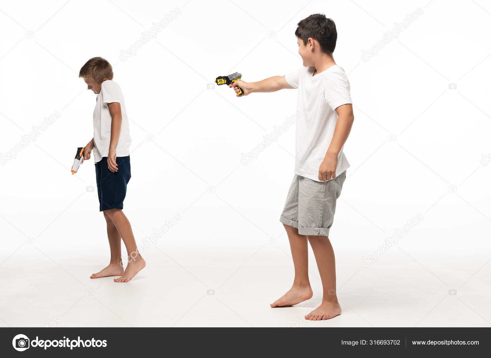 Boy Aiming Toy Gun Scared Brother White Background Stock Photo by ...