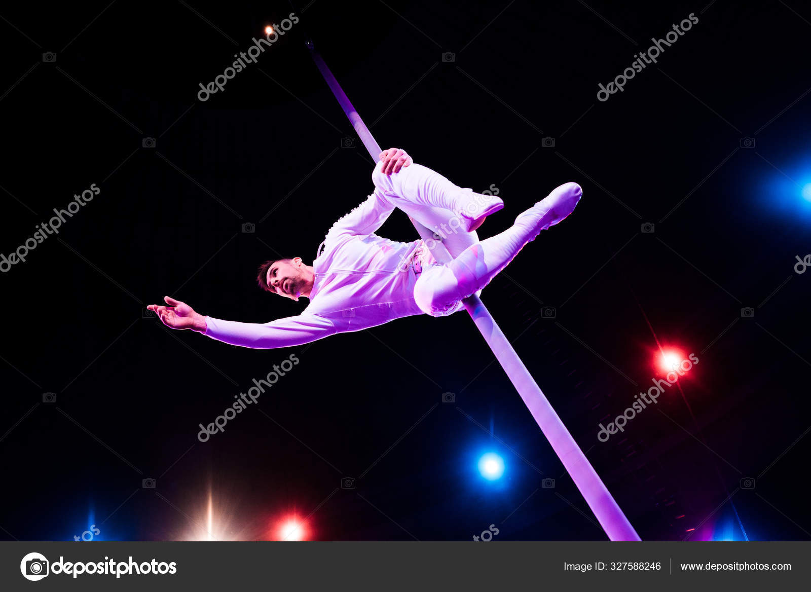 Back Light Handsome Acrobat Holding Metallic Pole While Performing ...