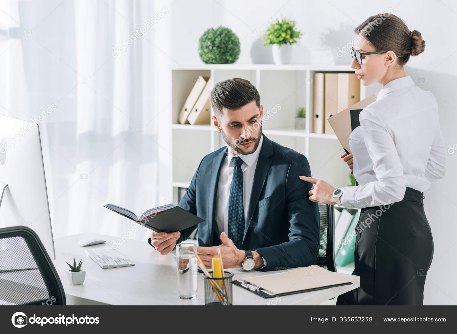 Attractive Secretary Touching Hand Handsome Businessman Office Stock