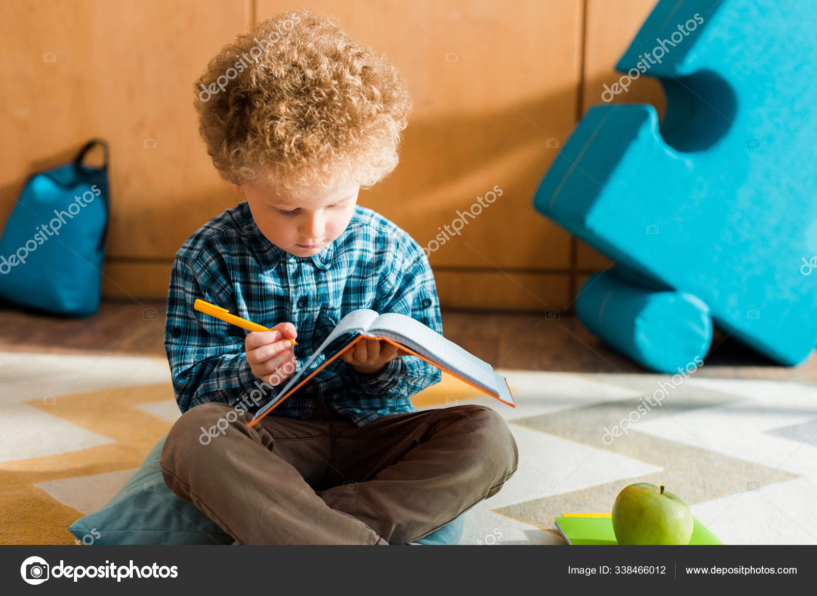 Smart Child Looking Notebook Holding Pen ⬇ Stock Photo, Image by ...