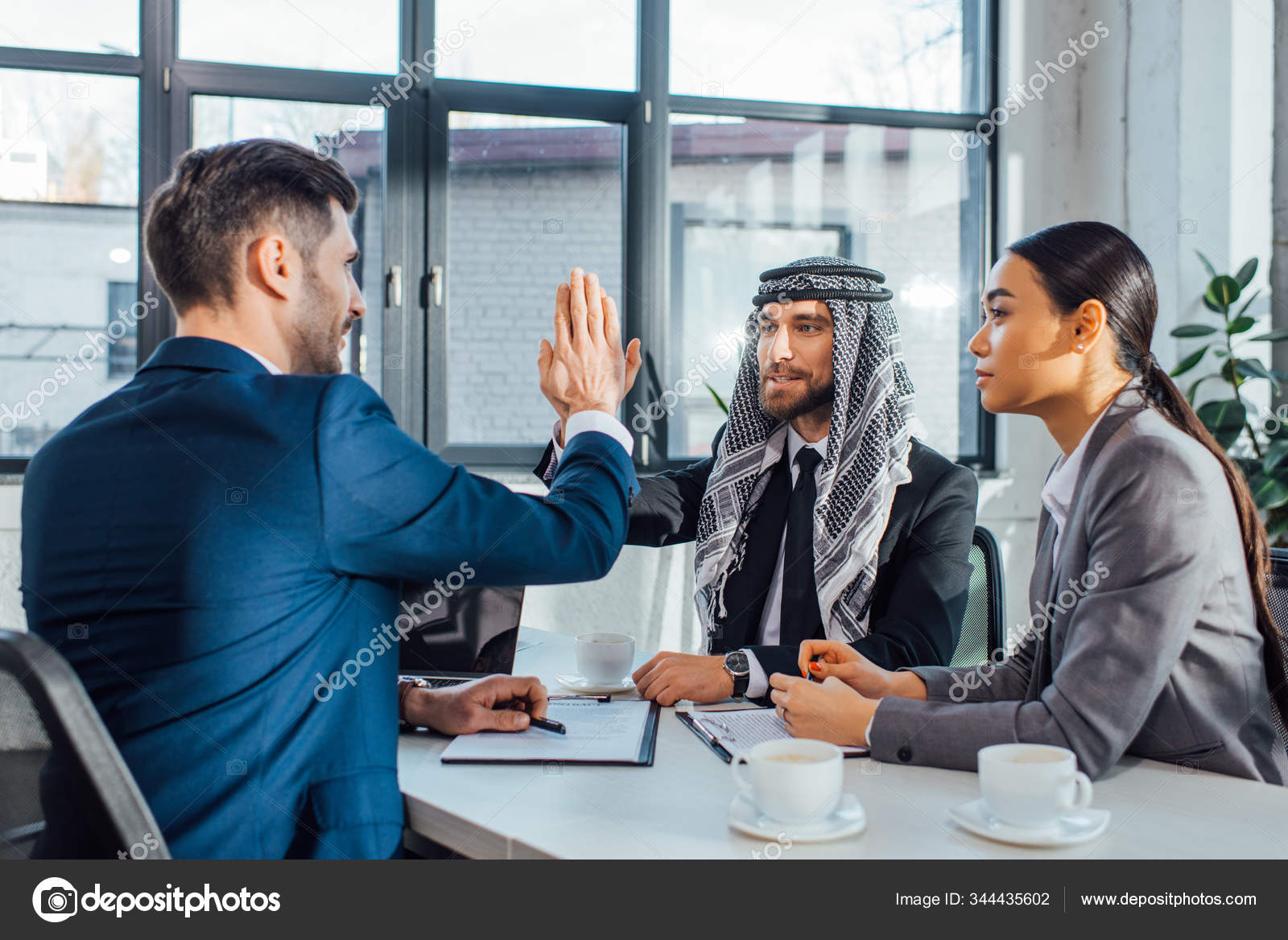 Positive Multicultural Business Partners Giving Highfive Meeting ...