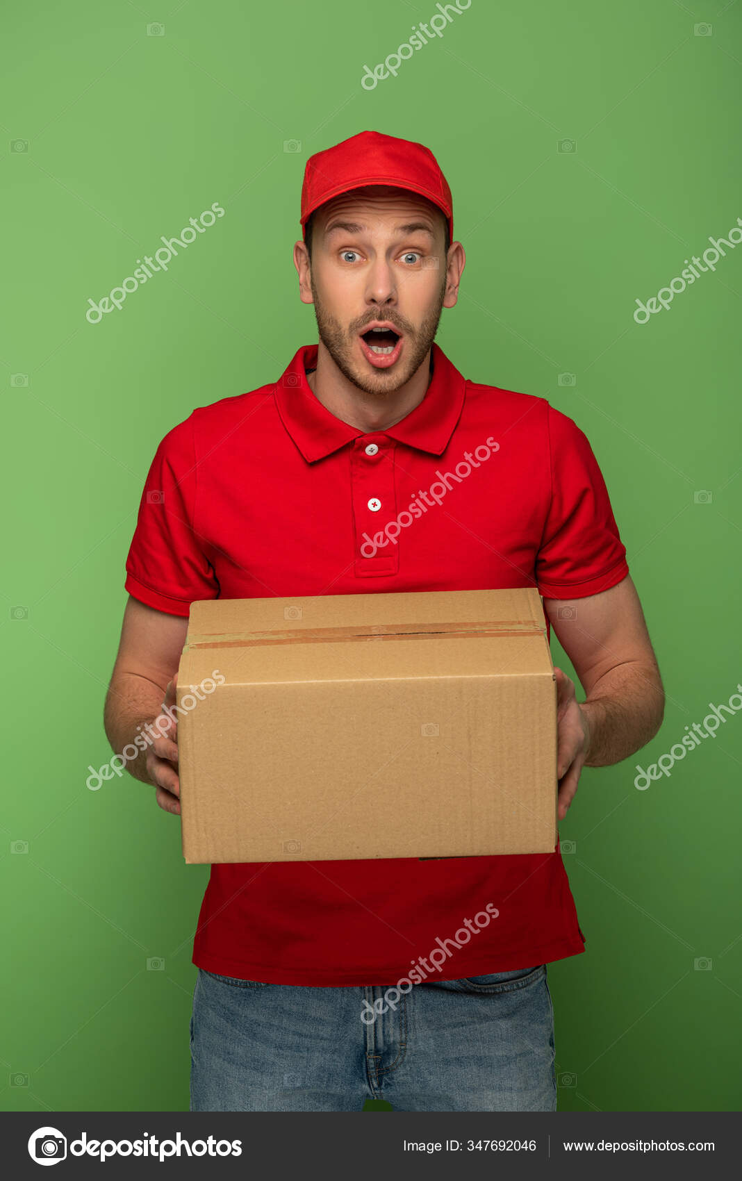 Shocked Delivery Man Red Uniform Holding Parcel Green Stock Photo by ...