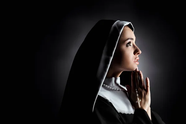 Nun praying in a monastery Stock Photo by ©oneinchpunch 158872506