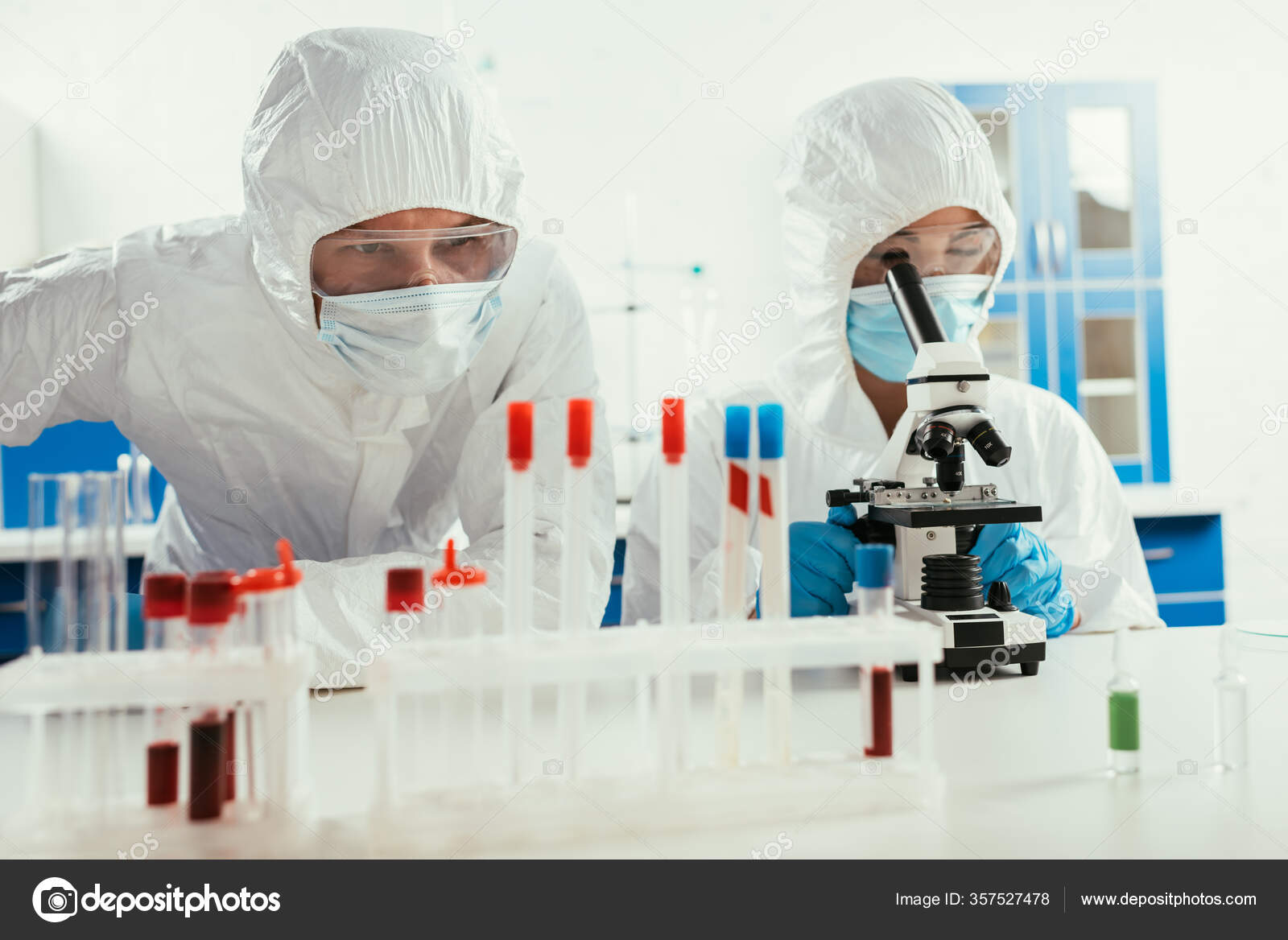Biochemist Working Microscope Colleague Looking Test Tubes Lab — Stock ...