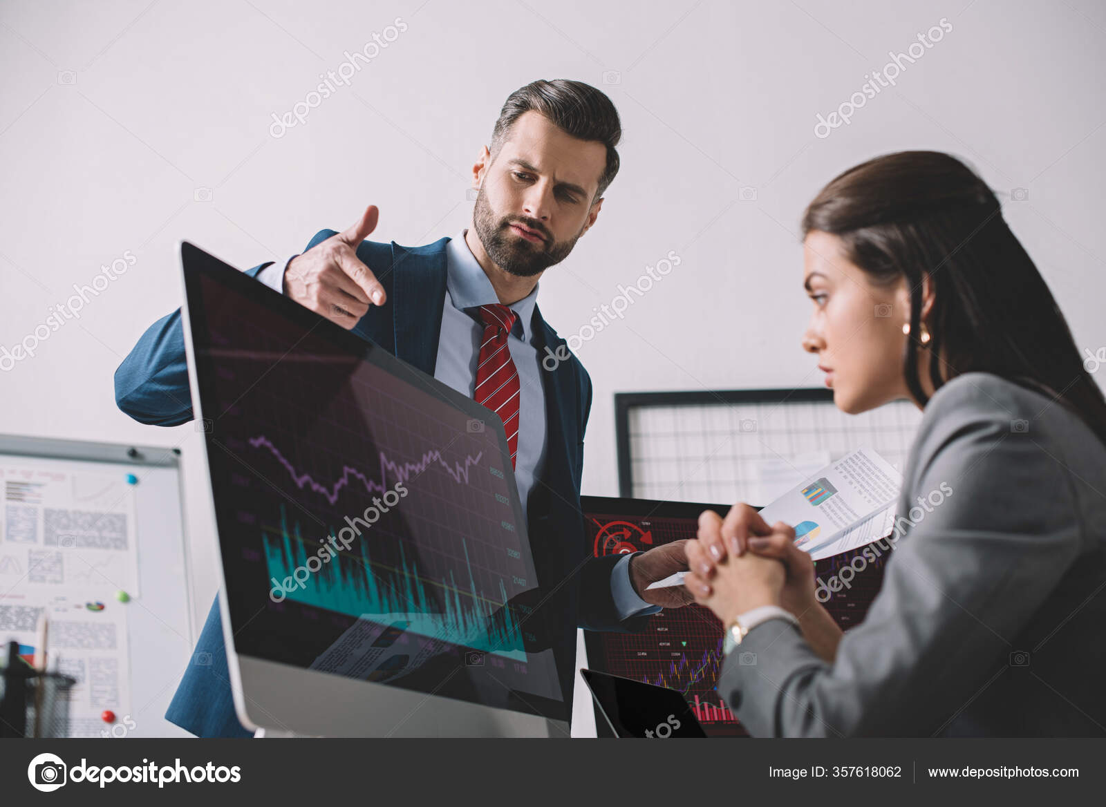 Selective Focus Data Analyst Papers Pointing Graphs Computer Monitor ...