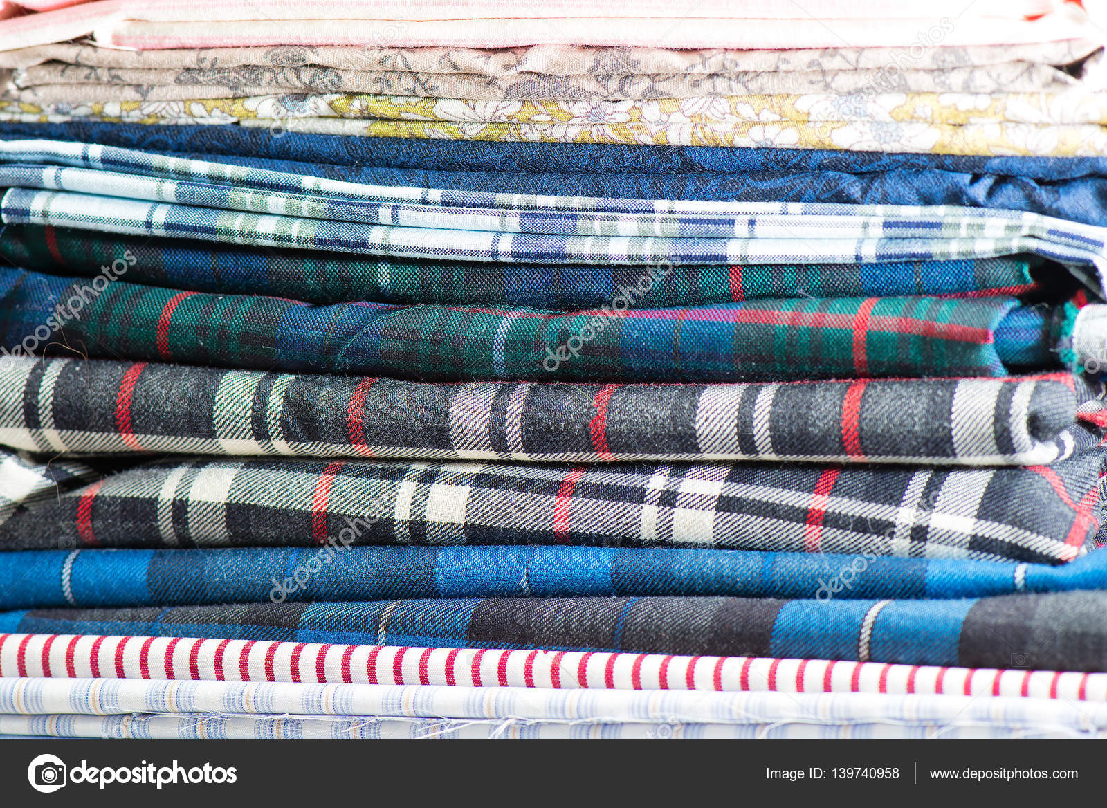 Fabric of various types stacked Stock Photo by ©michelangeloop 139740958