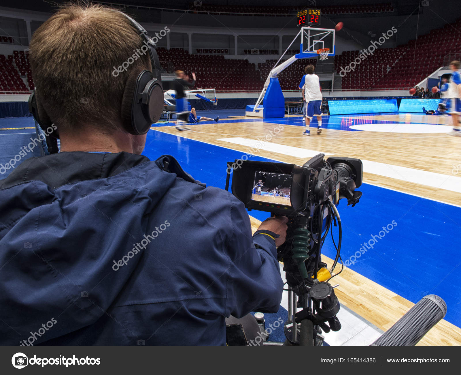 Professional camera with microphone at basketball game in modern ...