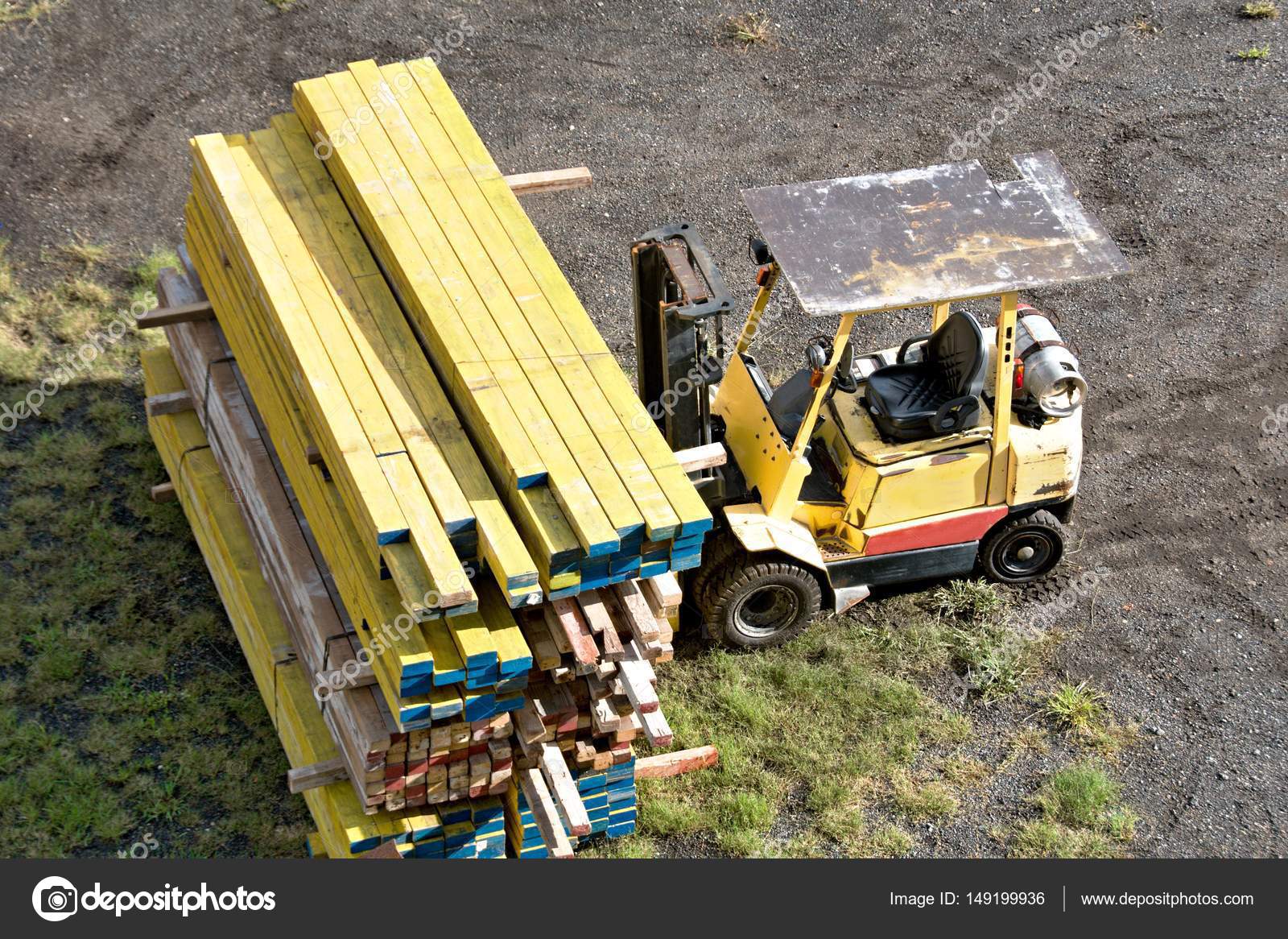 Stack of Timber and a Forklift — Stock Photo © geoffchilds #149199936