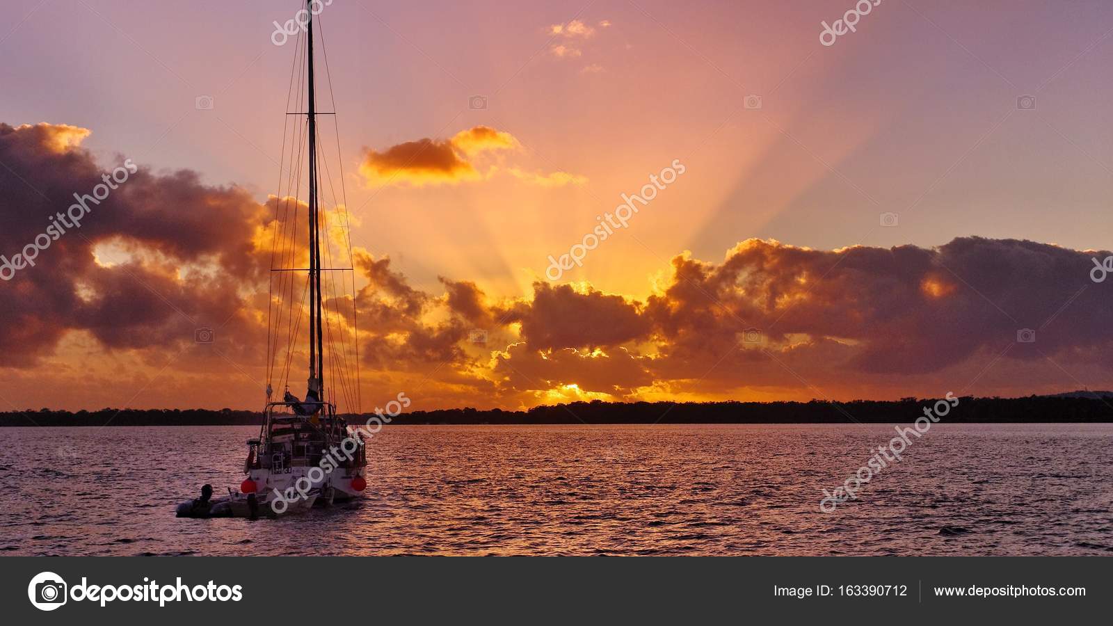 Crepuscular Rays Sunrise Seascape. — Stock Photo © geoffchilds #163390712
