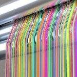 Textile machine with rainbow colors threads — Stock Photo © tdhster ...