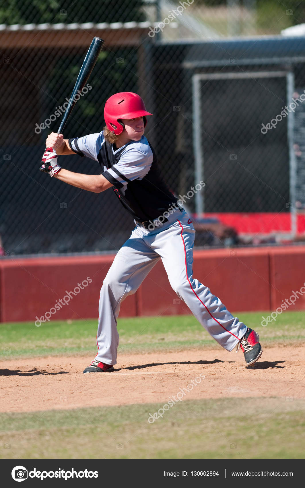 High School Baseball Player Batting