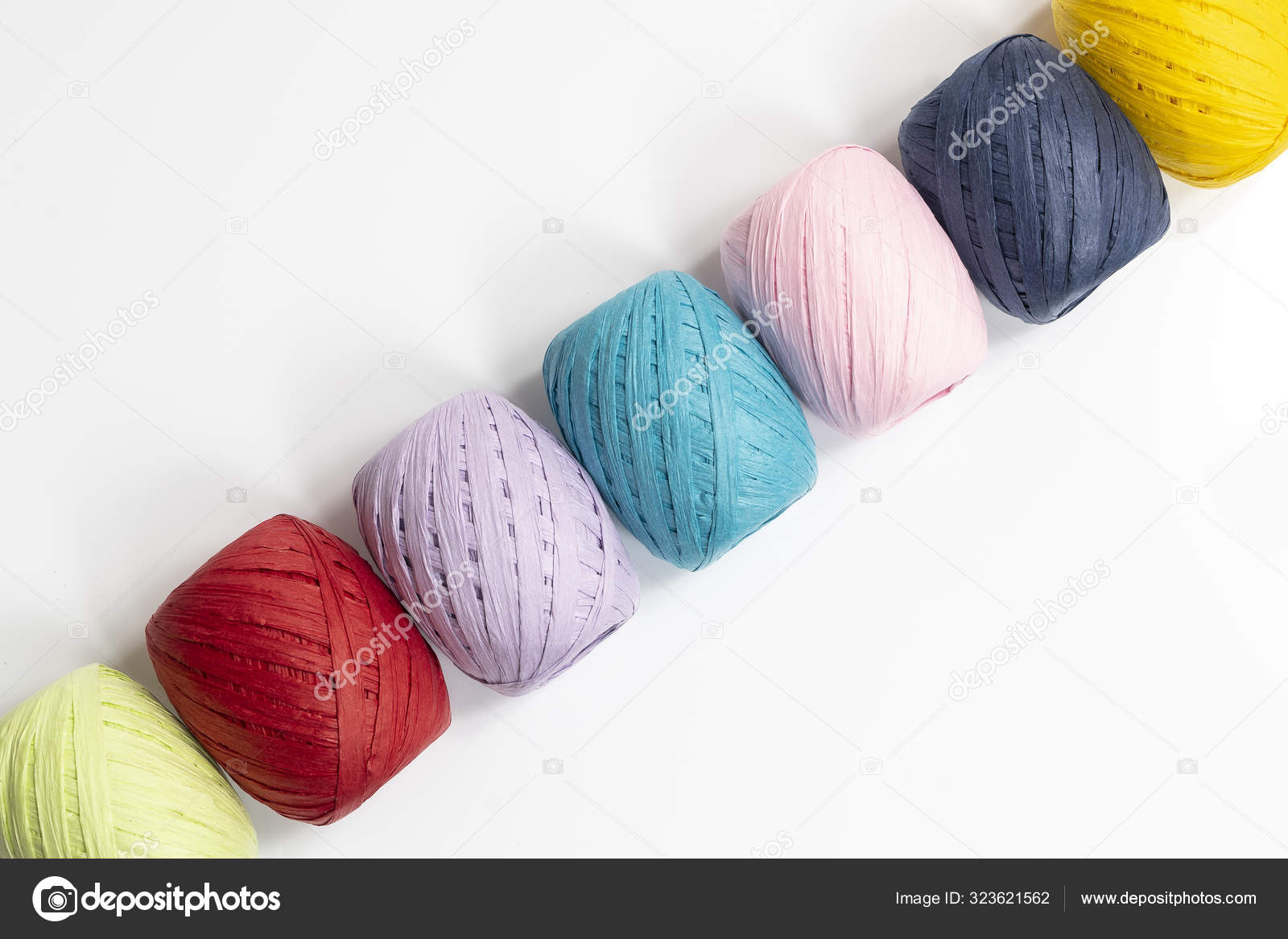 Some Balls Colored Raffia White Surface Stock Photo by ©YAYImages 323621562
