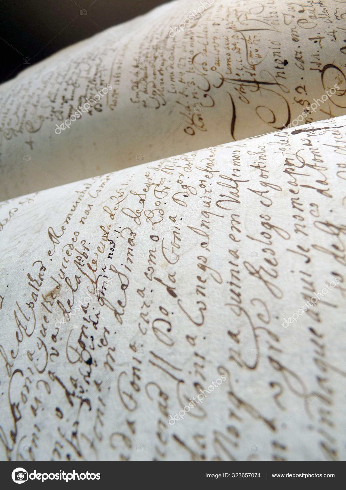 Old Manuscript Black Background Stock Photo by ©YAYImages 323657074