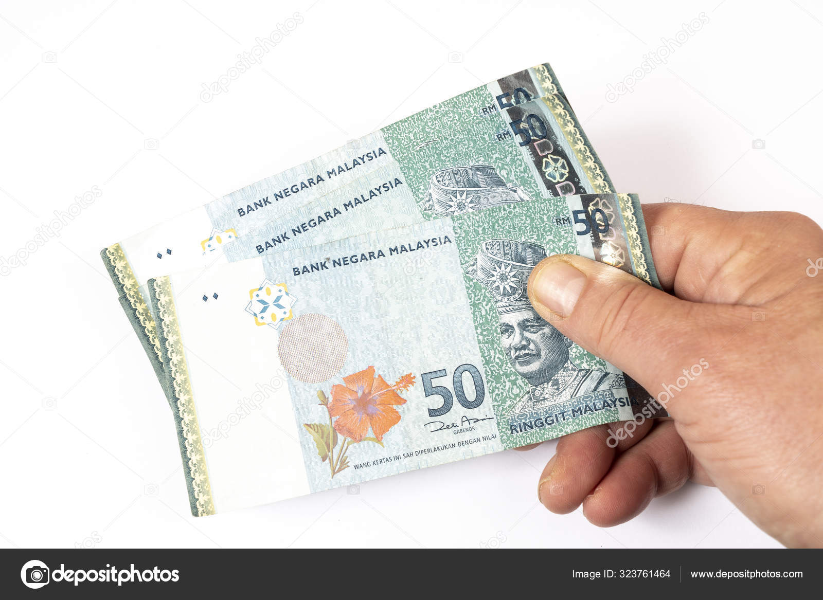 Three Malaysian Ringgit Banknotes Hand Stock Photo by ©YAYImages 323761464