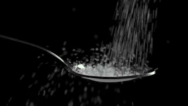 White salt falling down into a spoon, slow motion — Stock Video ...