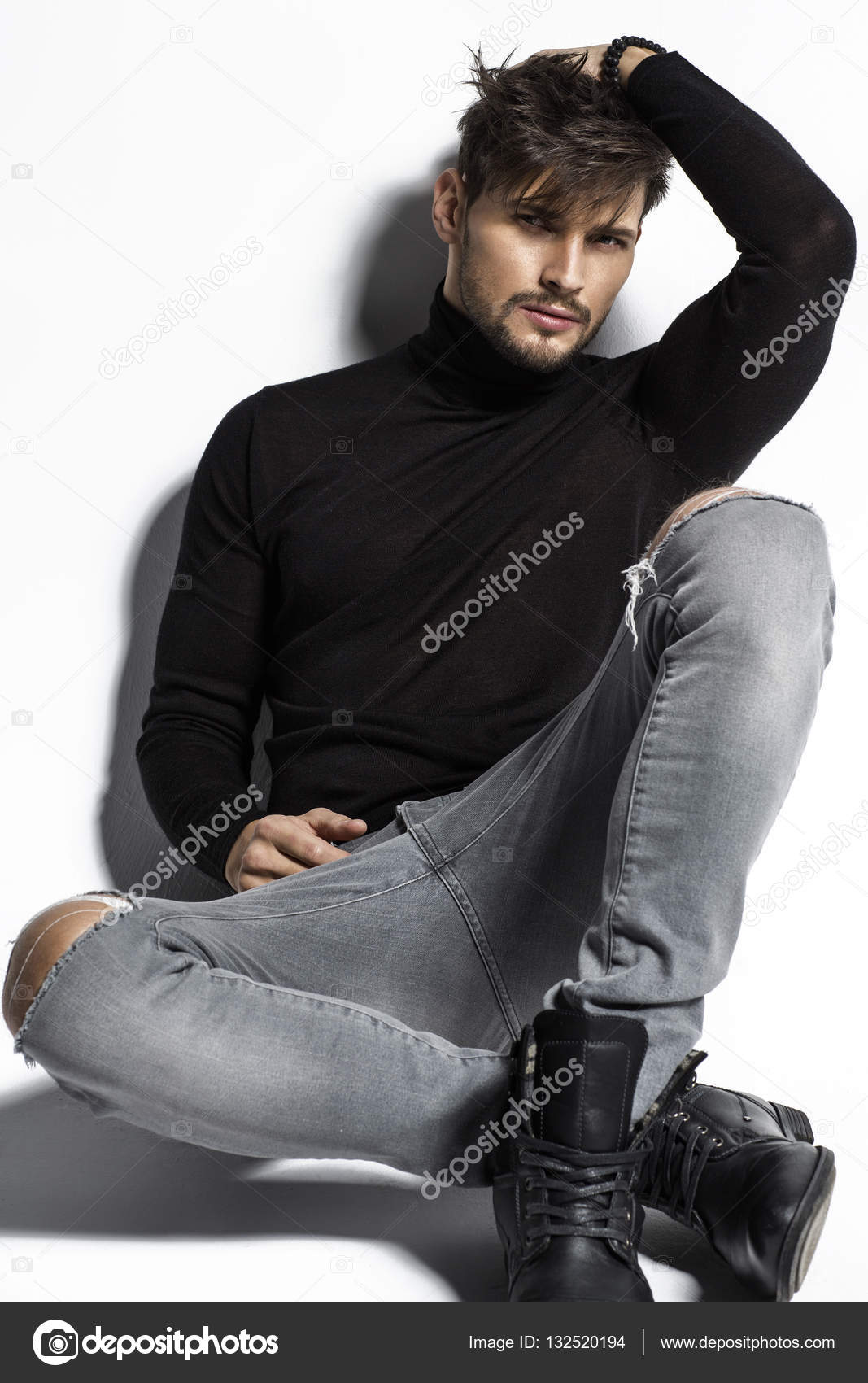 Handsome model touching his hair Stock Photo by ©kiuikson 132520194