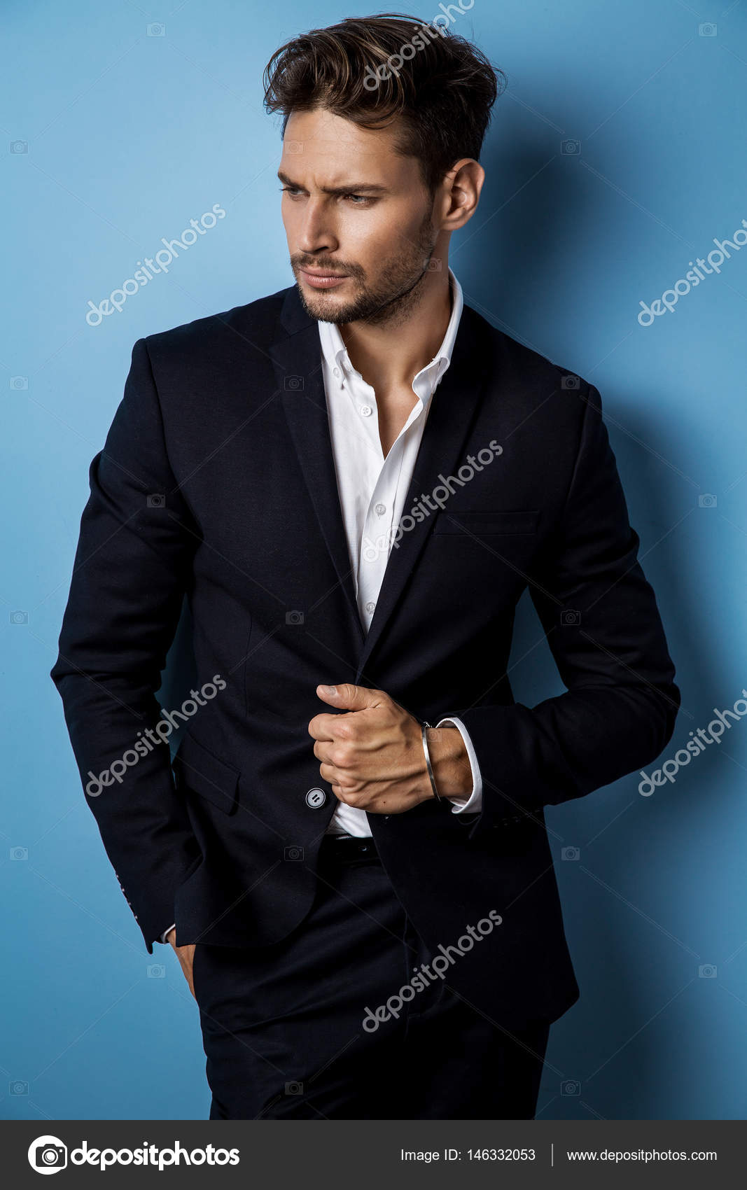 Handsome man wear black suit Stock Photo by ©kiuikson 146332053