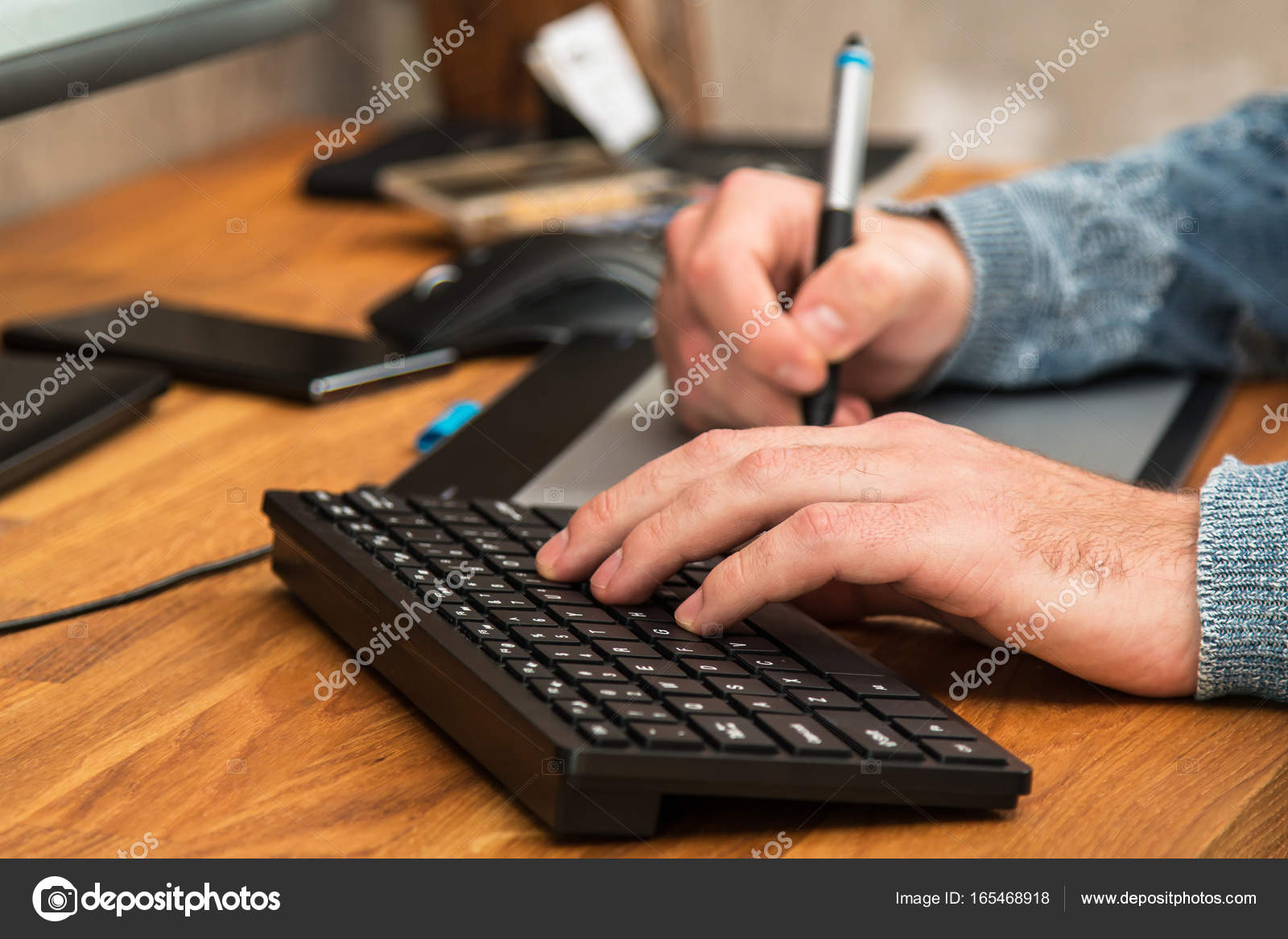 Man during using a graphic tablet — Stock Photo © AY_PHOTO #165468918