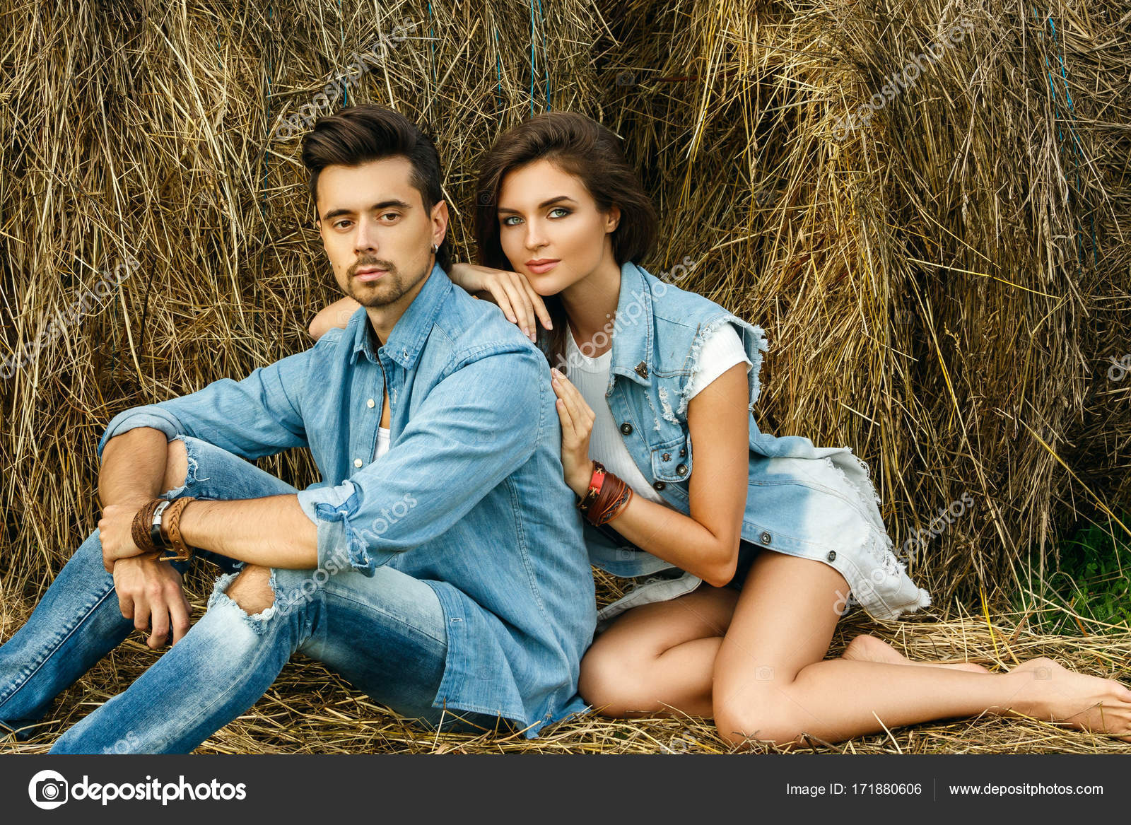 Young couple relaxing among haystacks — Stock Photo © AY_PHOTO #171880606