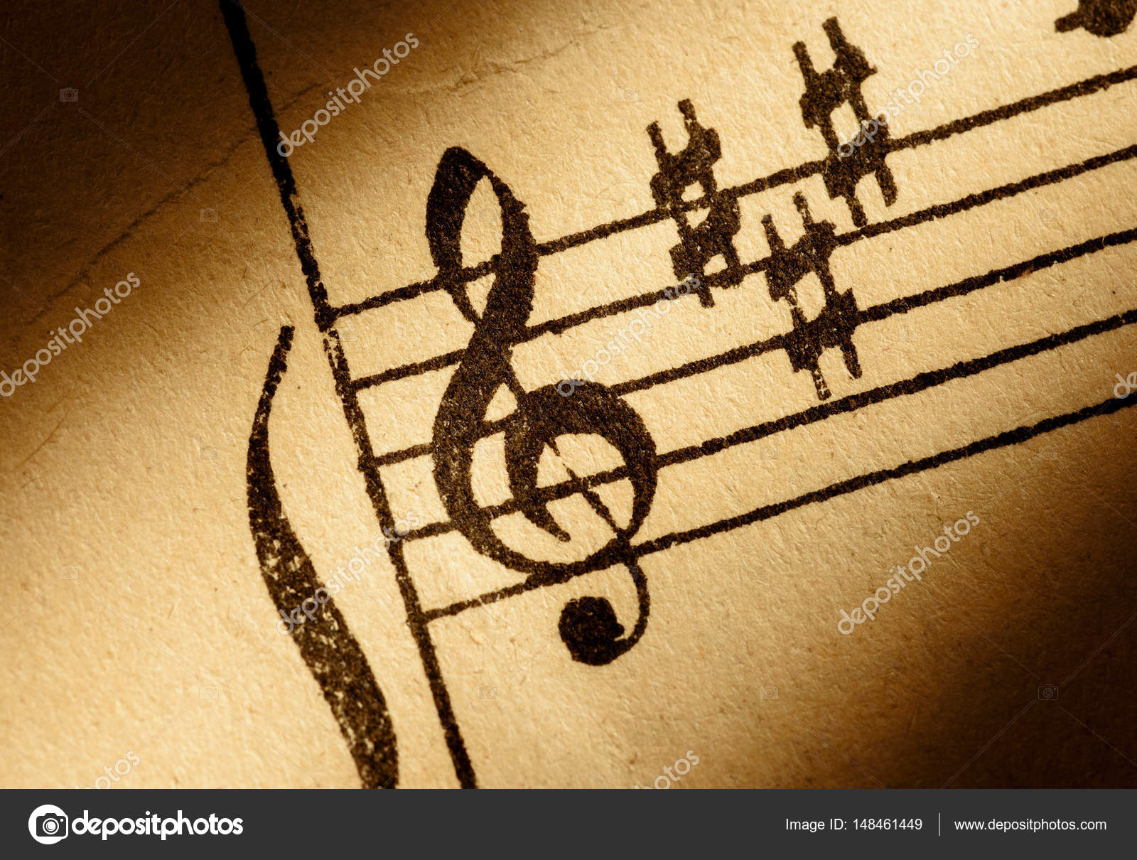 Treble clef on old music sheet Stock Photo by ©estudiosaavedra 148461449
