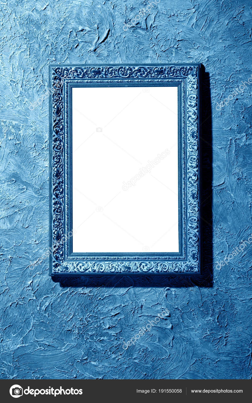 Blank blue frame on blue wall Stock Photo by ©estudiosaavedra 191550058