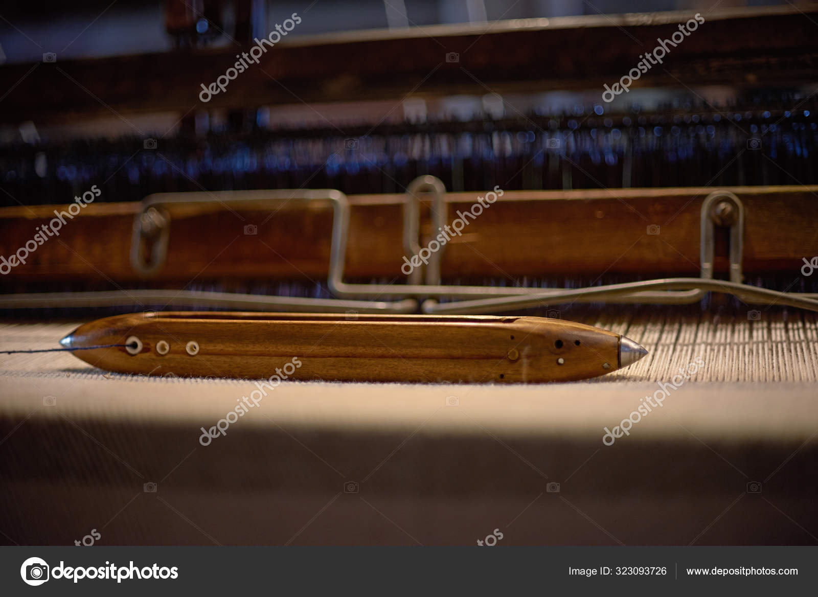 Traditional loom with the work started, unfinished woolen fabric with ...