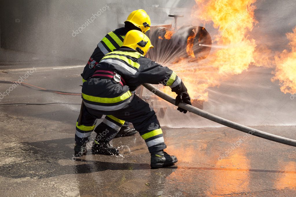Firefighters in action. Fire department training. — Stock Photo © macor ...