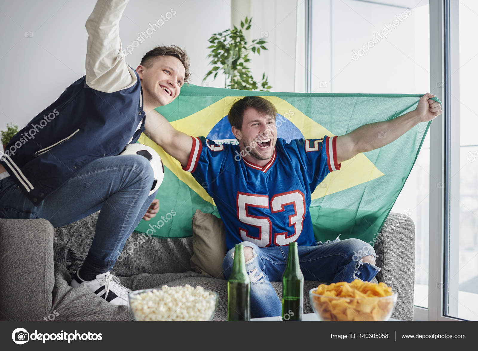 Friends cheering for team Stock Photo by ©gpointstudio 140305058