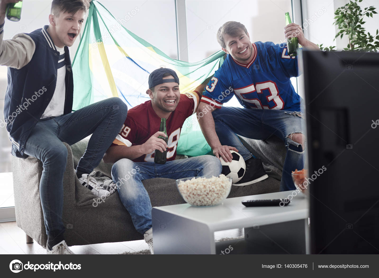 Friends cheering for team Stock Photo by ©gpointstudio 140305476