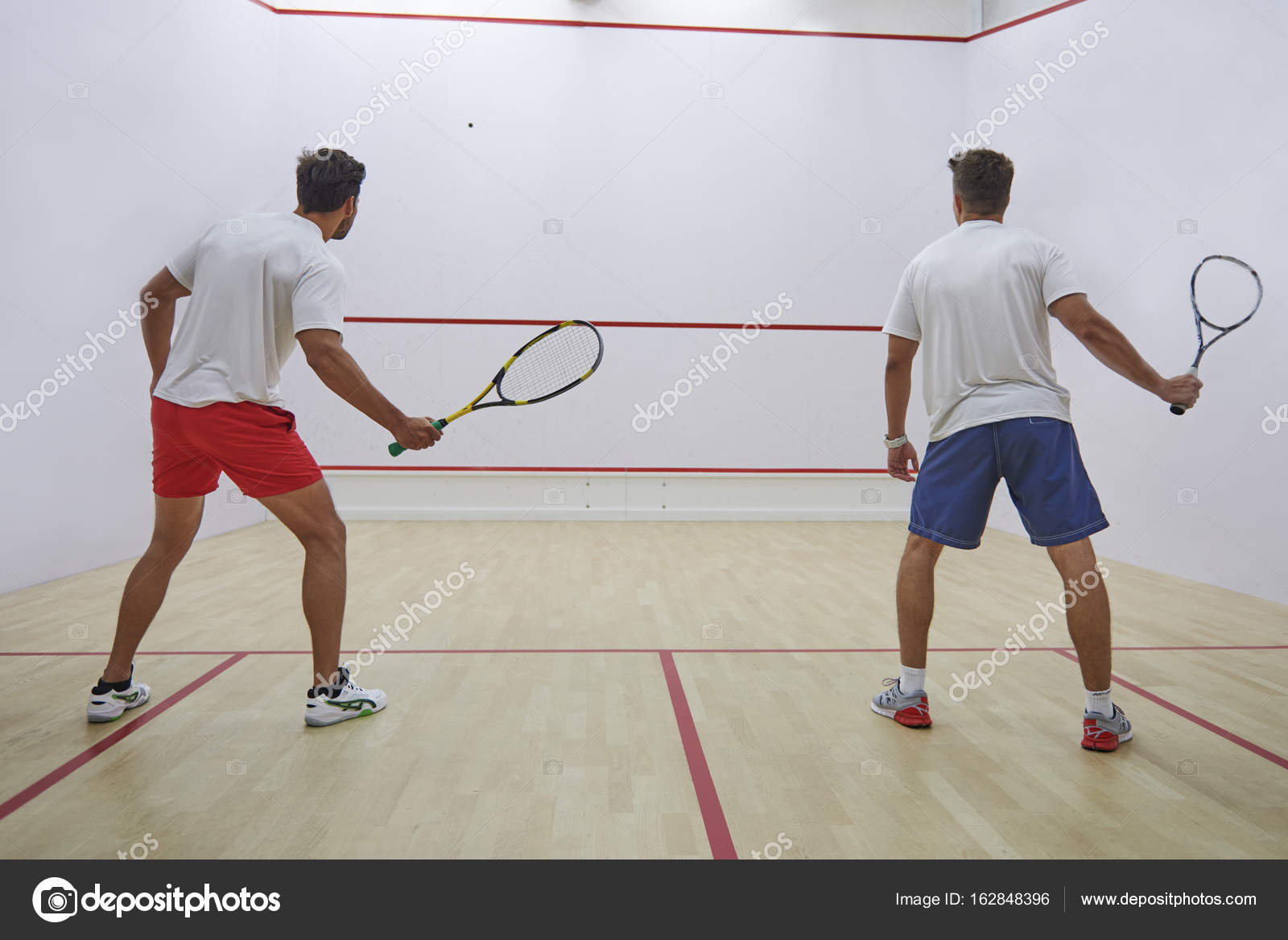Two men playing squash — Stock Photo © gpointstudio #162848396