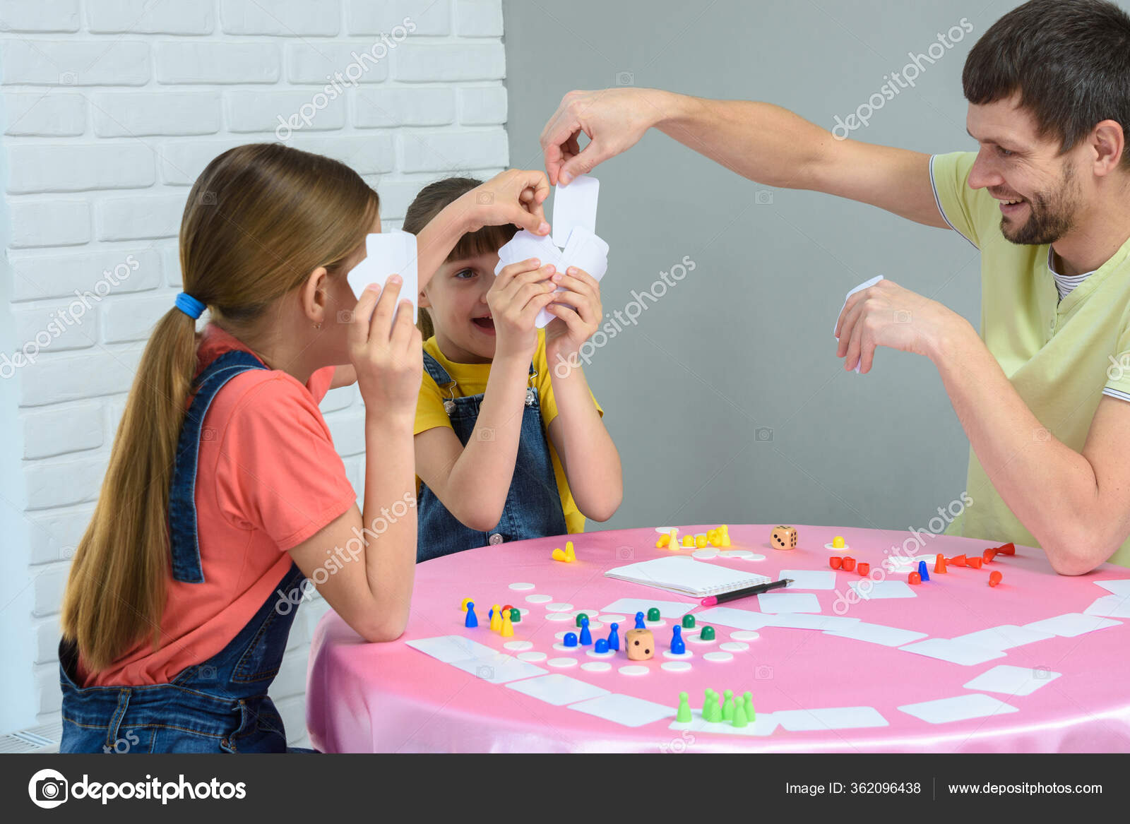 Dad Draws Desired Card Board Game Daughters — Stock Photo © Madhourses ...