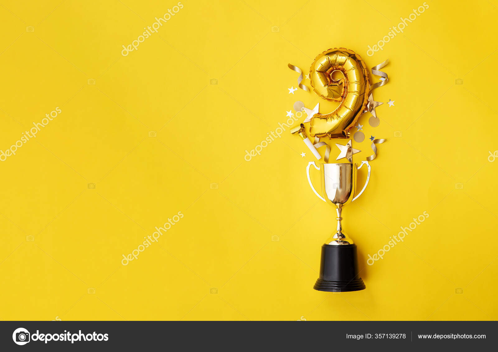 Number 9 gold anniversary celebration balloon exploding from a winning ...