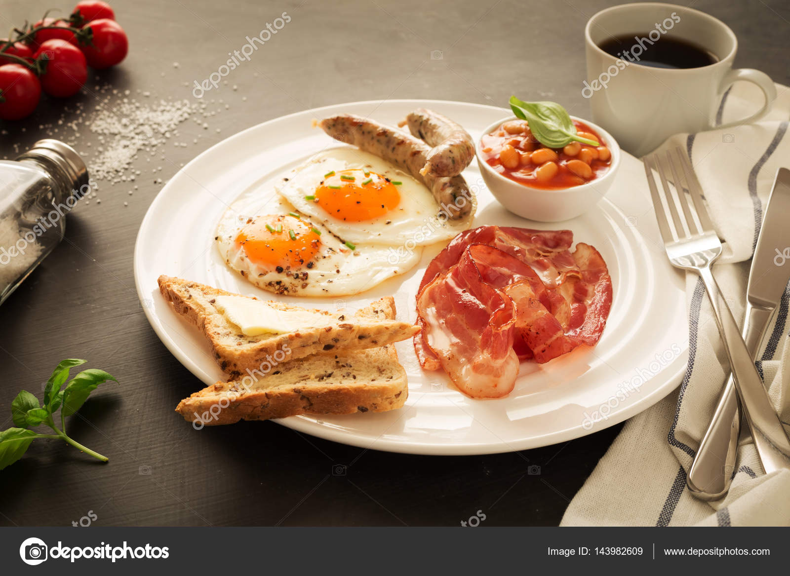 Full english breakfast on white plate, black background. Stock Photo by ...