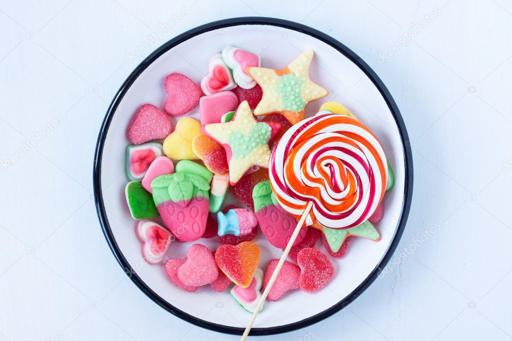 Lollipop and assorted jelly candies Stock Photo by ©Bernashafo 125200882