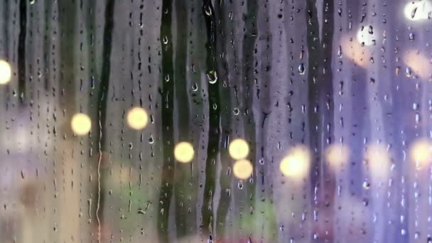 Water drops sliding down on store window glass — Stock Video ...