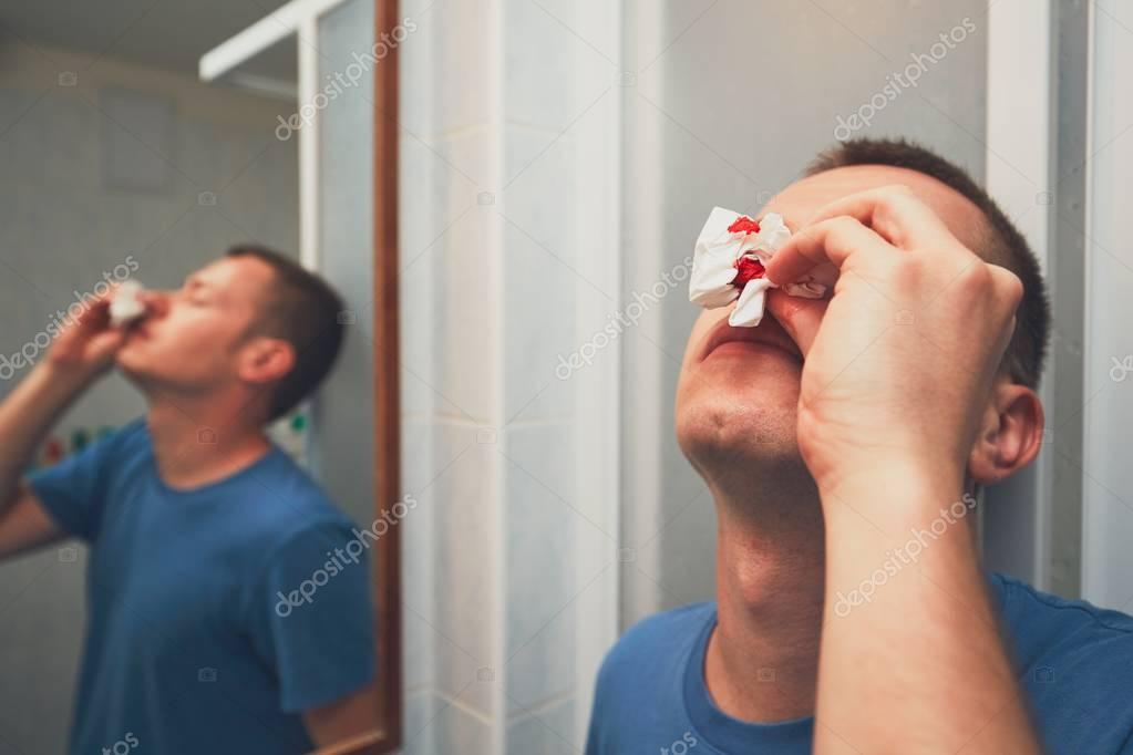 Man with nose bleed — Stock Photo © Chalabala #157008922