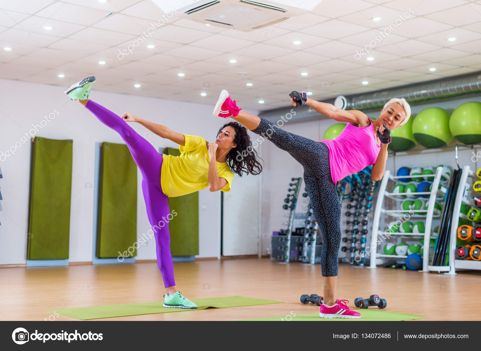 Two models dancing Zumba. Stock Photo by ©undrey 134072486
