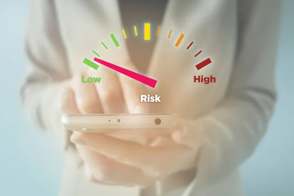 Smartphone with Low Risk meter - Stock Image - Everypixel