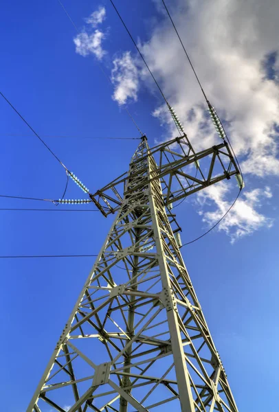 High voltage electrical overhead line on blue sky - Stock Image ...