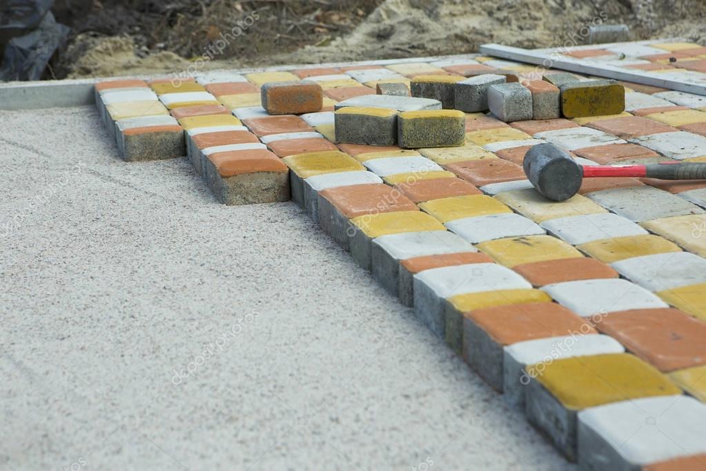 Laying Paving Slabs by mosaic close-up. Road Paving, constructio ...