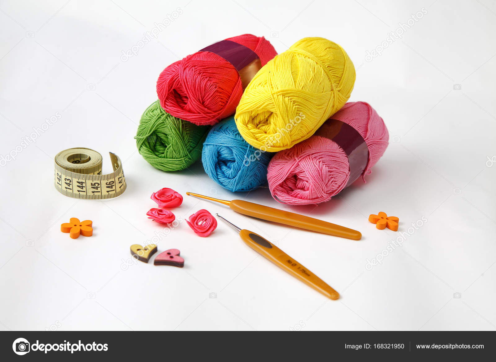 Cotton yarn, crochet hooks , tailoring tape and decorative buttons ...